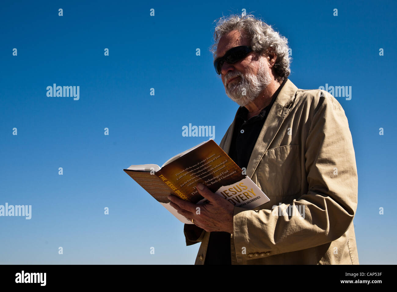 Prof. James D. Tabor looks through his new book detailing recent ...