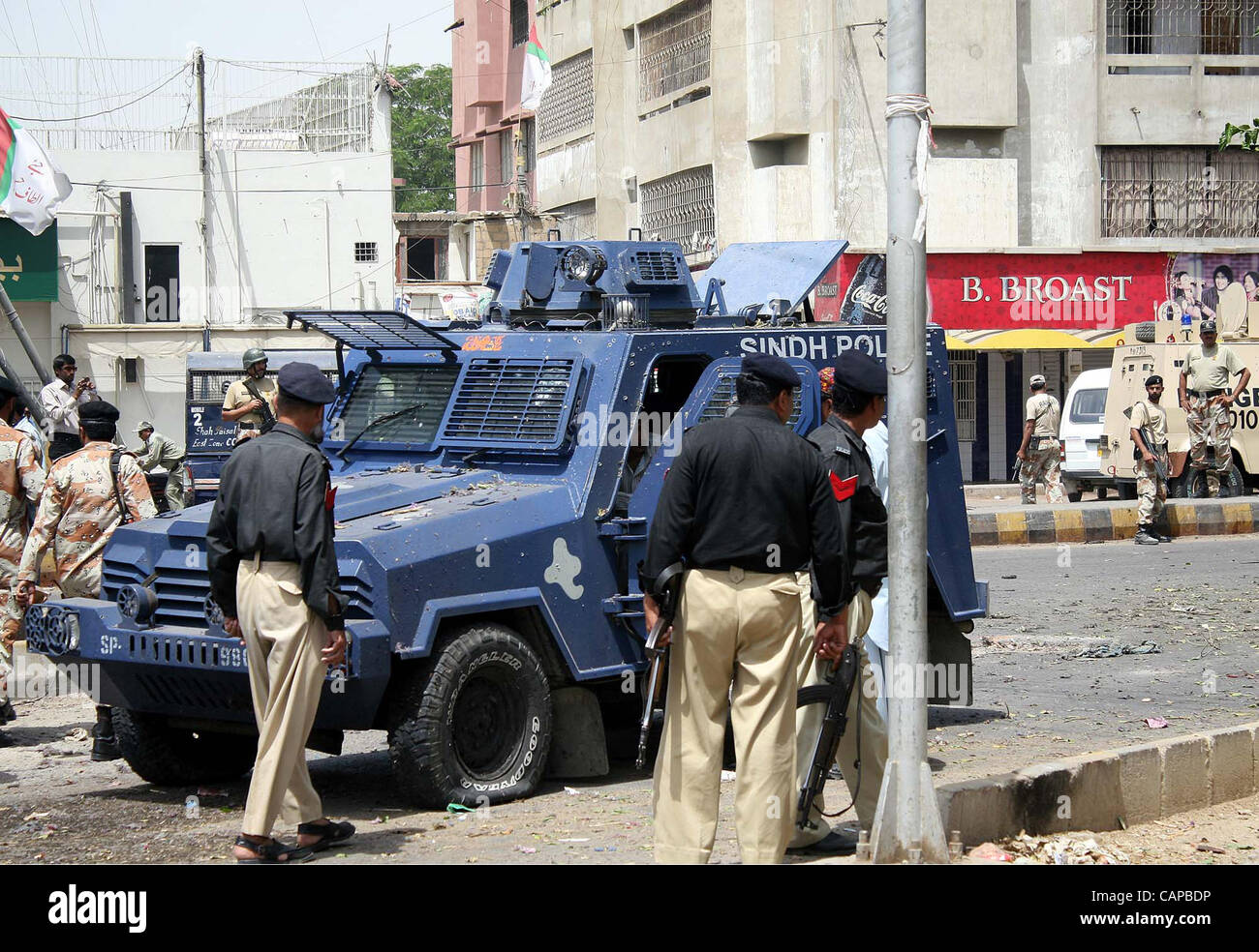 Security official inspect the damaged police armored personnel carrier ...