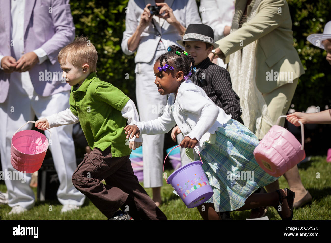 Children rush from the starting line during an Easter egg hunt in the ...
