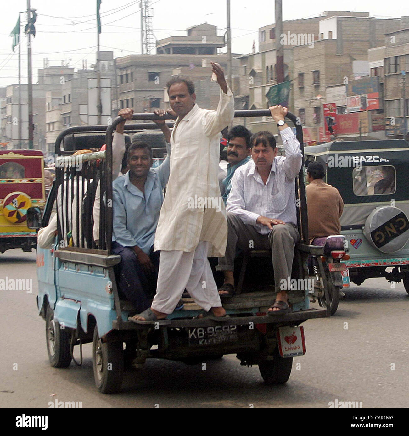 Passengers travel on overloaded vehicle hi-res stock photography and ...