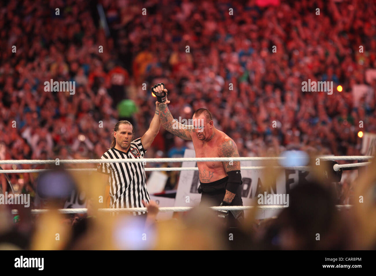 WWE legends The Undertaker wrestled Triple H at Wrestlemania 28 in ...