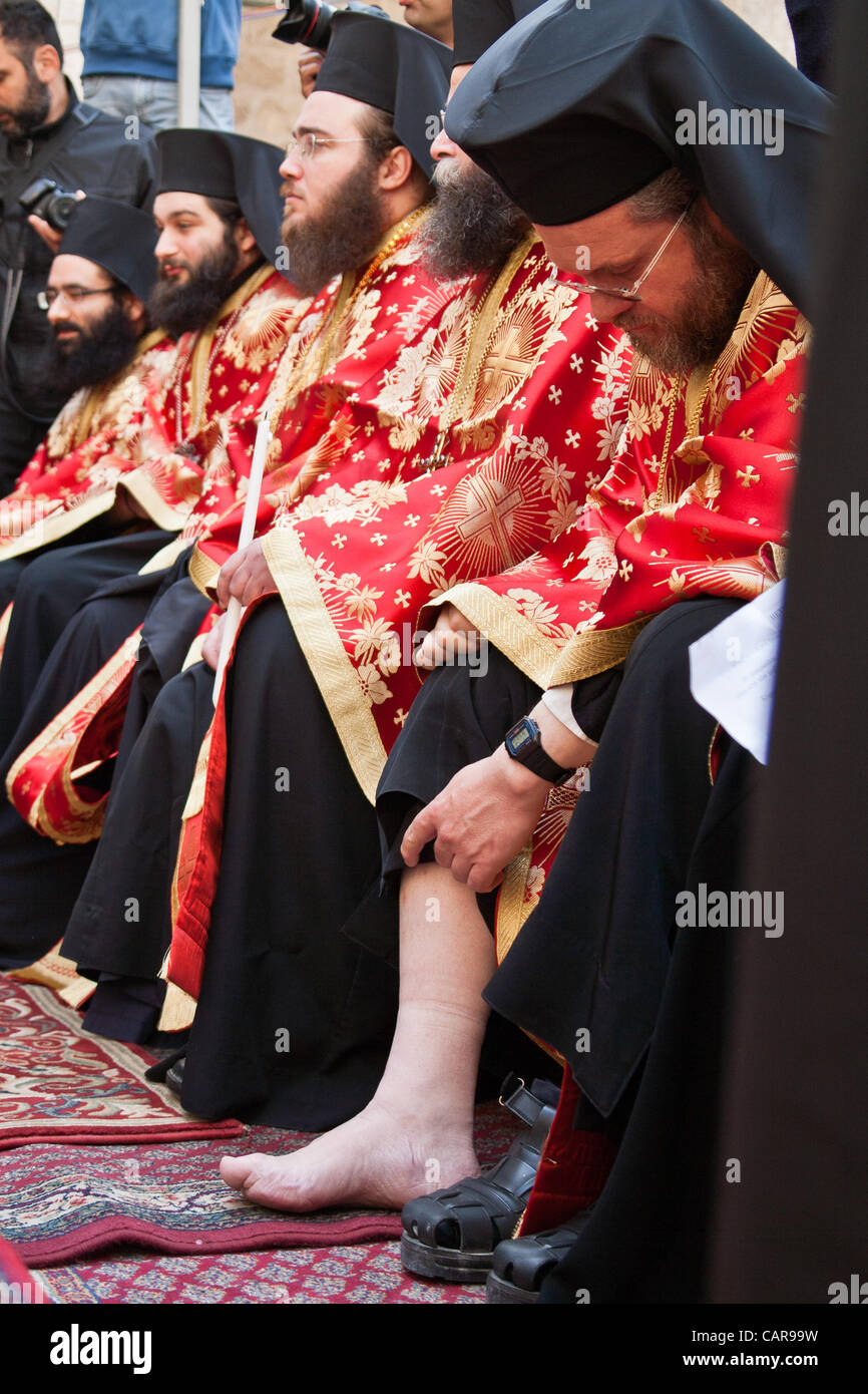 Barefooted priests await their turn in the traditional Washing of the ...