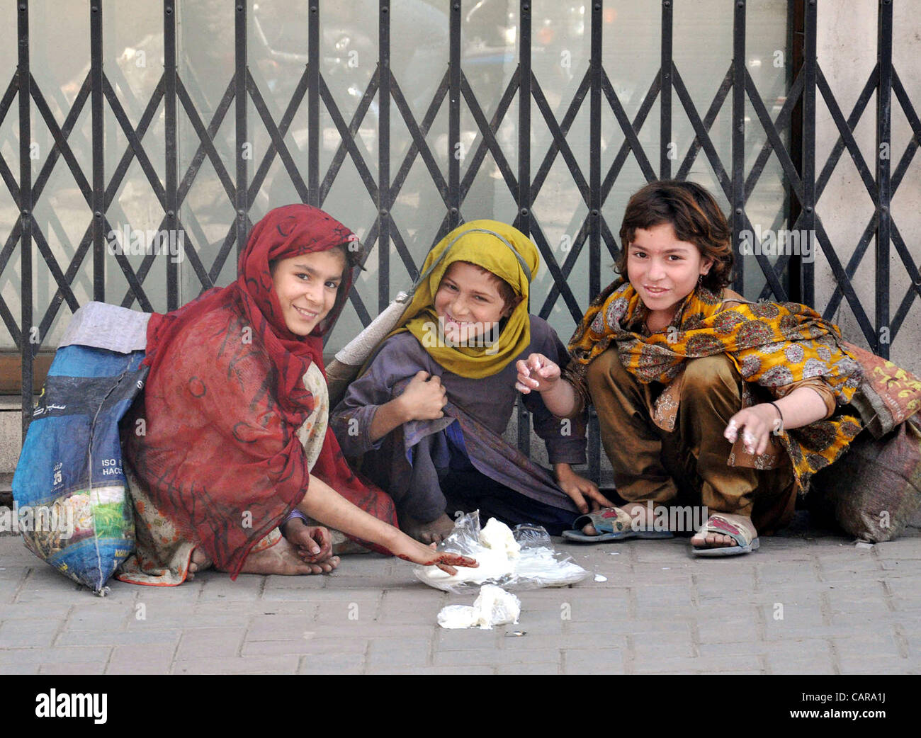 Children, who collect useful items from garbage to earn their ...