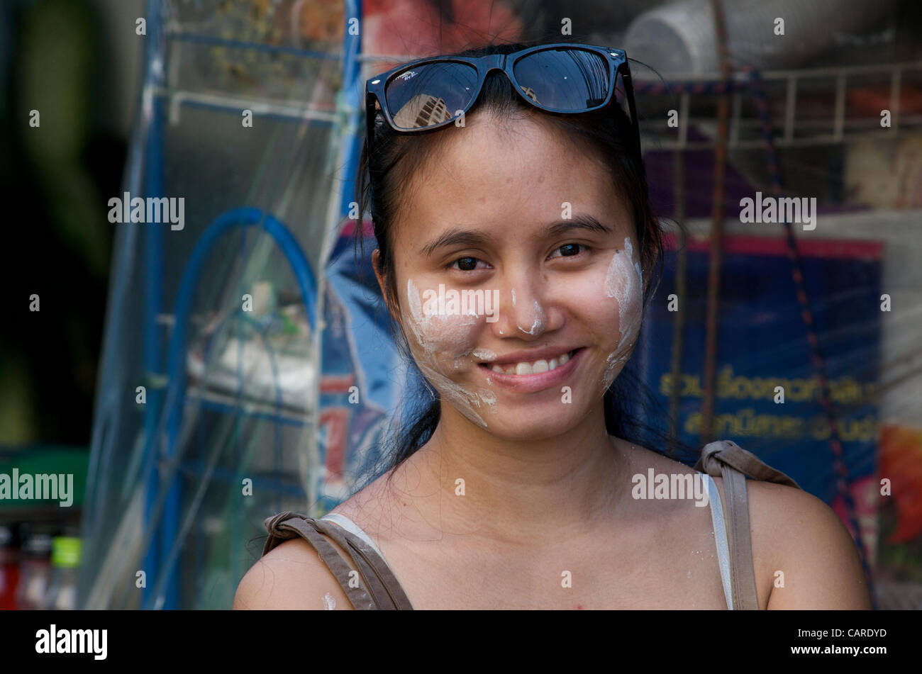 Portrait of a young Thai woman w/ powder on face, taking part in the ...