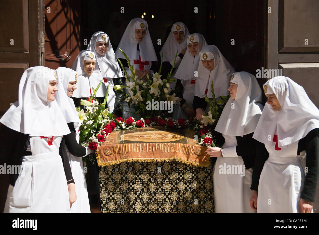 Nuns prepare flower bouquets before the passing of crucessions on Holy ...