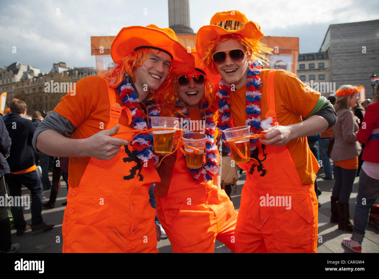 LONDON, UK, 14th Apr, 2012 Three revelers pose for the camera during ...