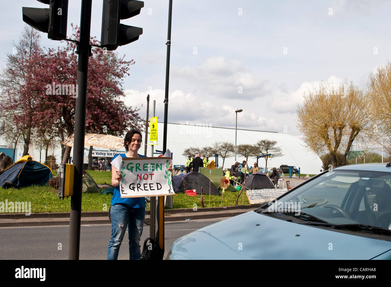 Girl with 'Green not Greed' placard, Protesters against the ...