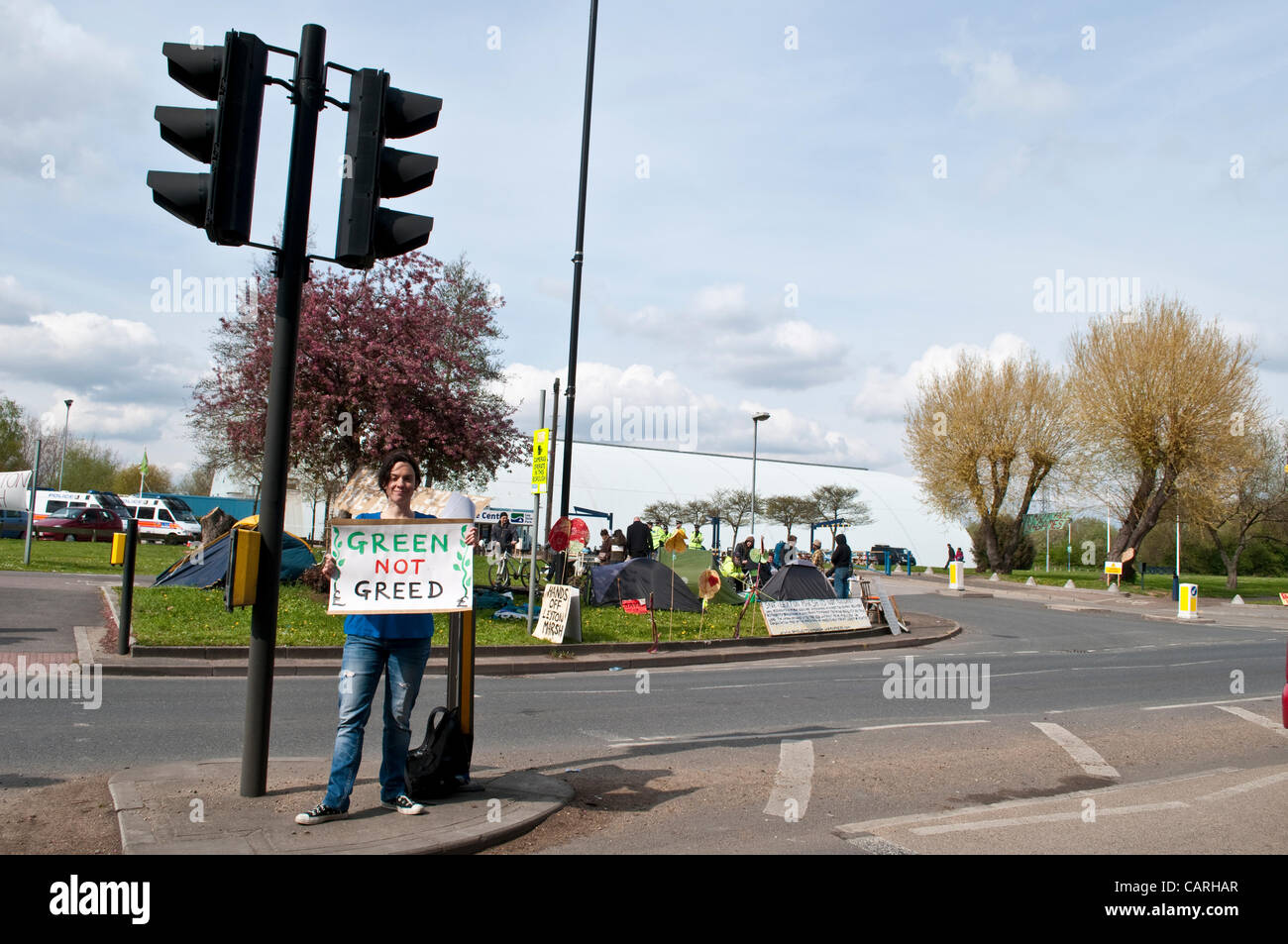 Girl with 'Green not Greed' placard, Protesters against the ...