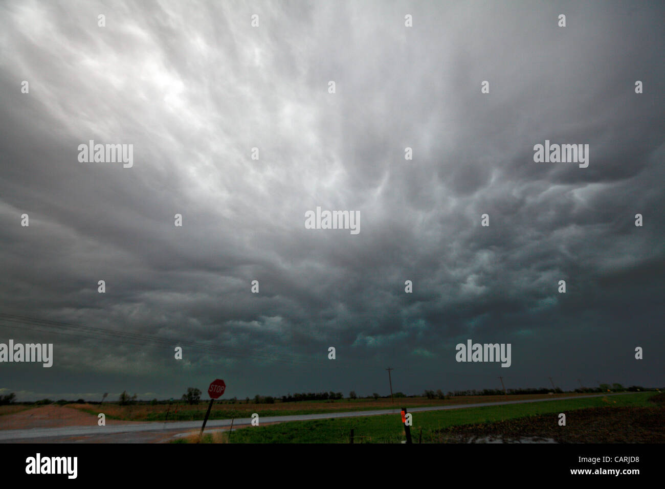 Rural Nebraska USA 14 April 2012 -- Storm clouds above a rural road ...