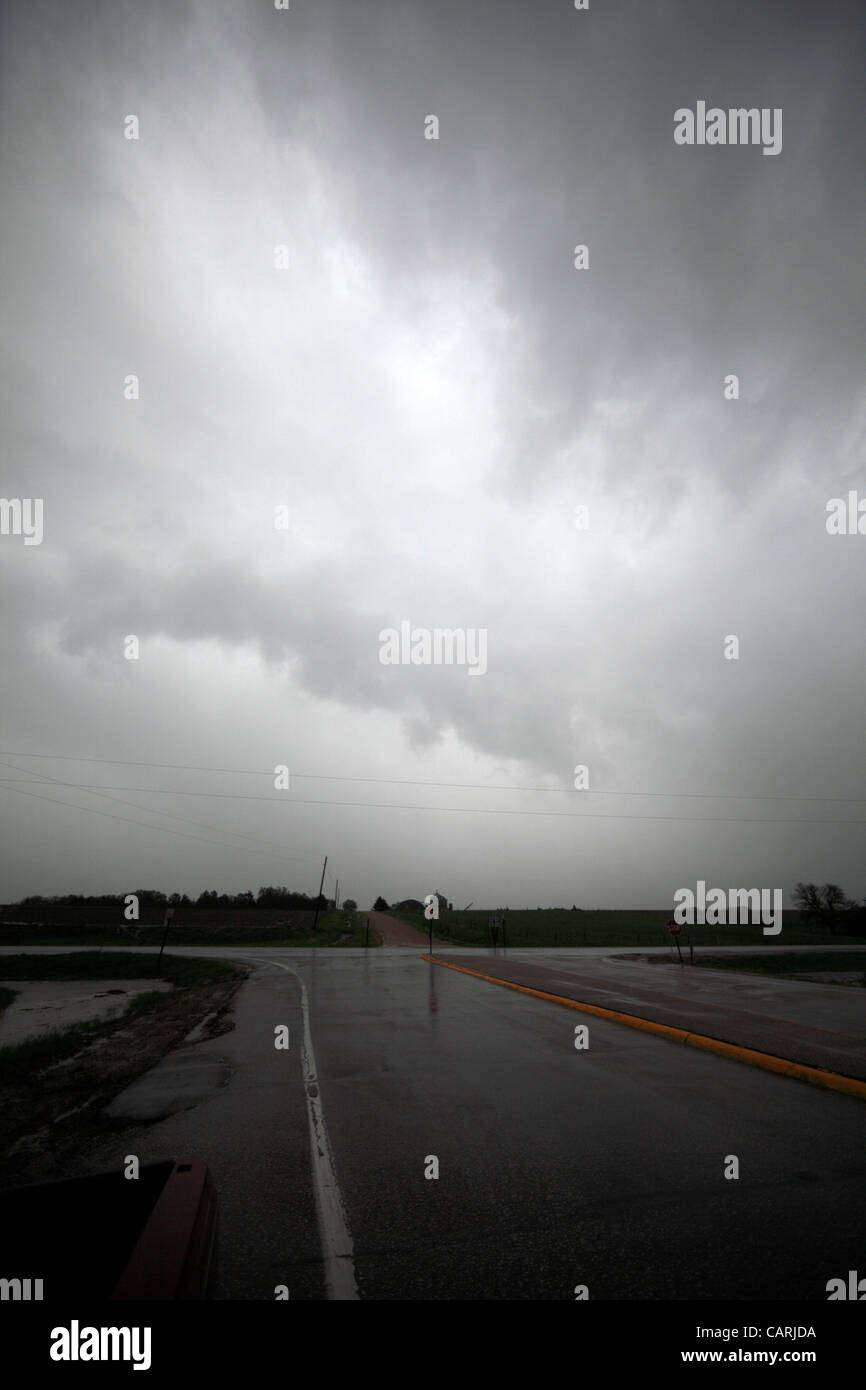 Rural Nebraska USA 14 April 2012 -- Storm clouds above a wet asphalt ...