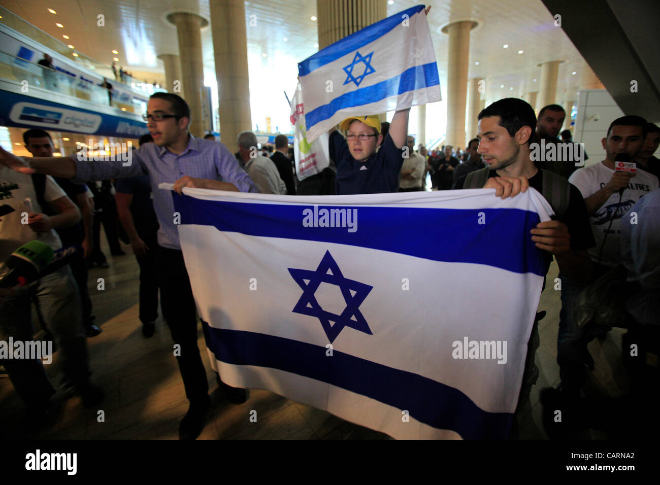 Right-wing activists hold Israeli flags during a demonstration as pro ...