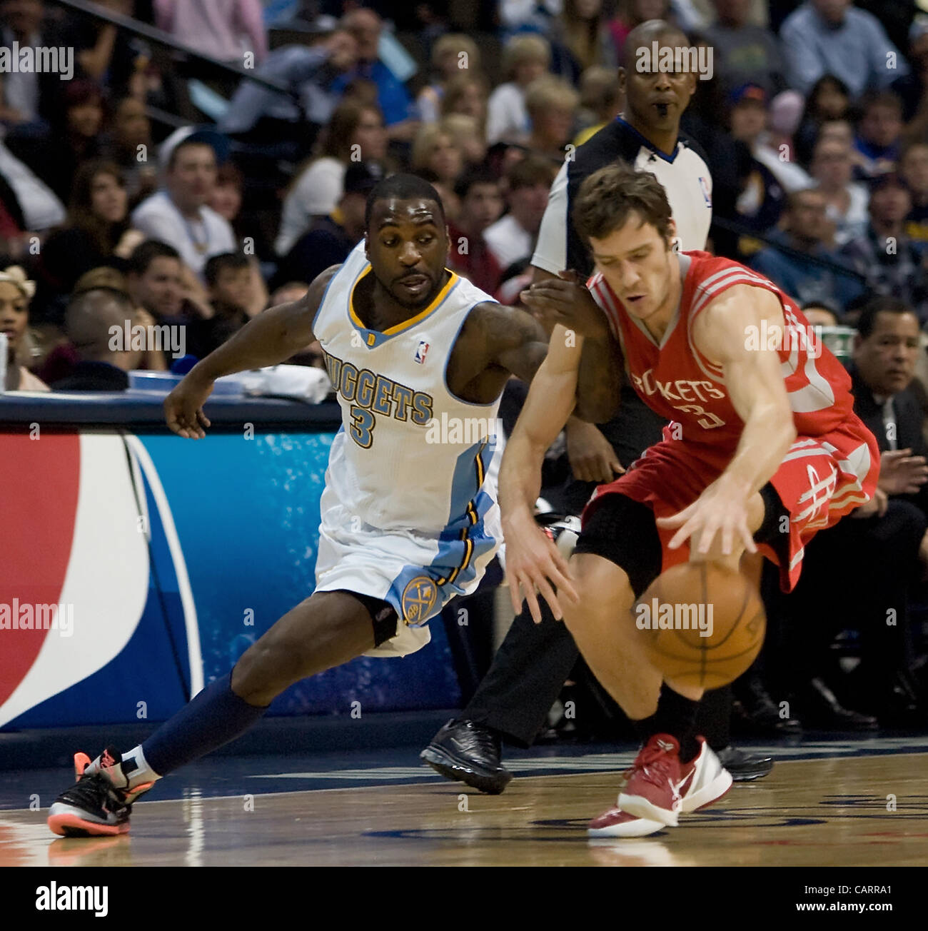 April 15, 2012 - Denver, CO, USA - Nuggets TY LAWSON, left, goes for a ...