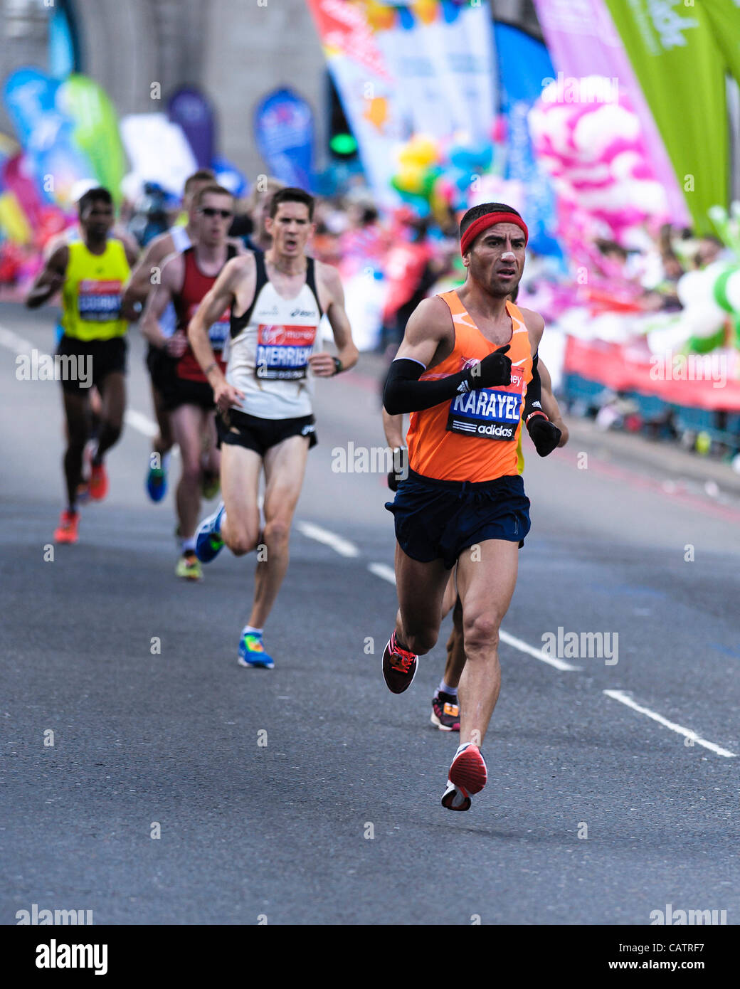 Runners cross Tower Bridge running the London Marathon on 22 April 2012 ...