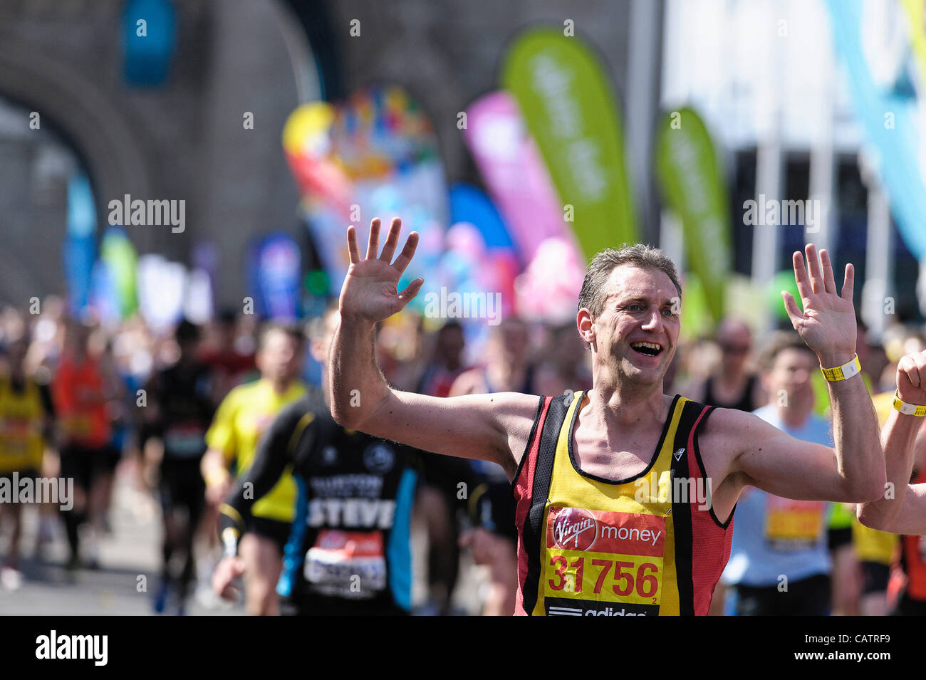 Runners cross Tower Bridge running the London Marathon on 22 April 2012 ...