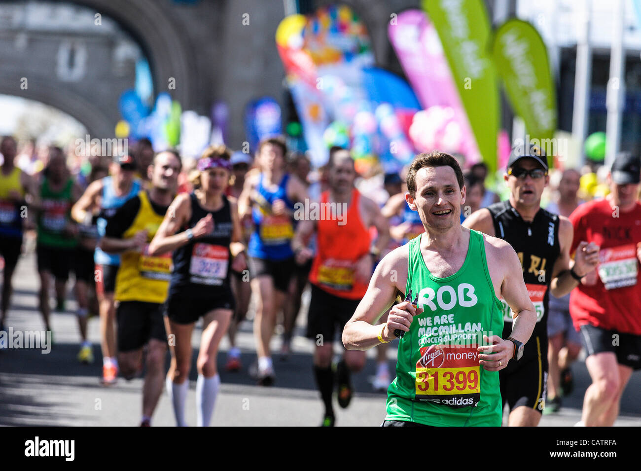 Runners cross Tower Bridge running the London Marathon on 22 April 2012 ...