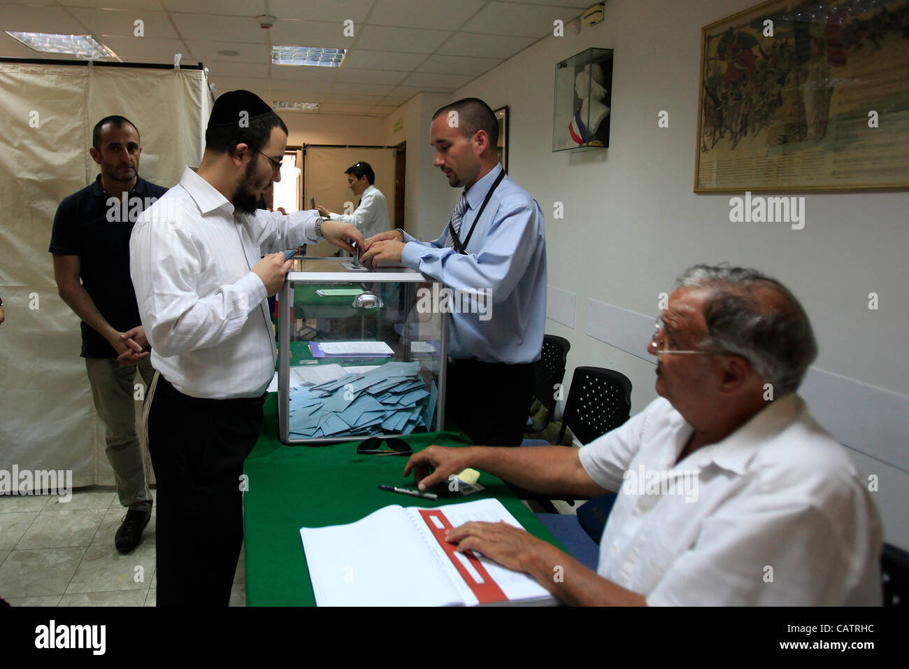 An Ultra Orthodox Jewish man with French nationality casts his vote for ...
