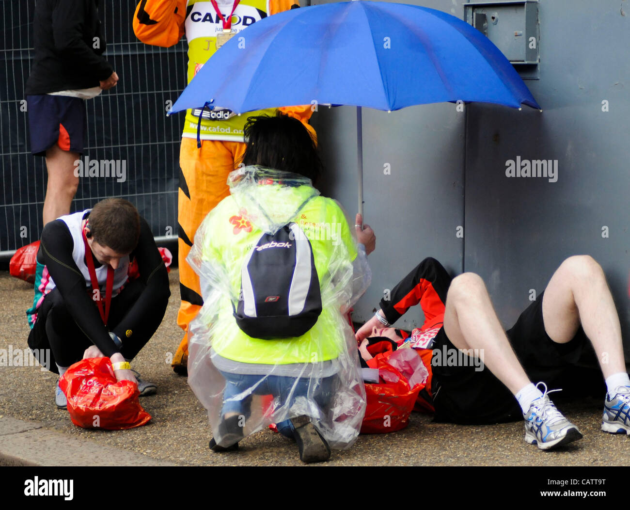 London, UK. 22/04/12. A casualty of the London Marathon 2012 suffering ...