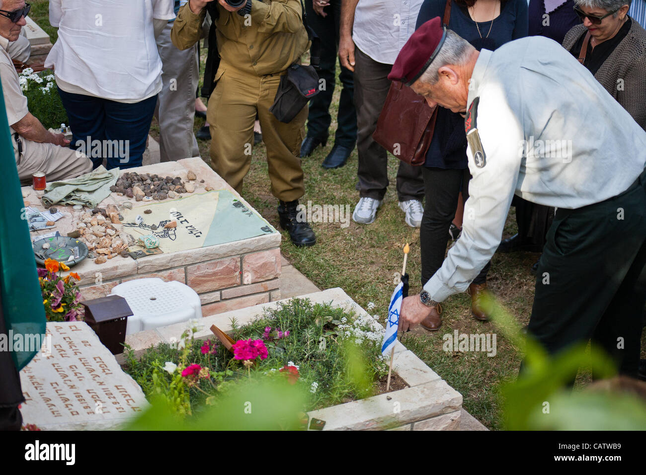 IDF Chief of Staff, Lieutenant General, Benny Gantz, places small flags ...