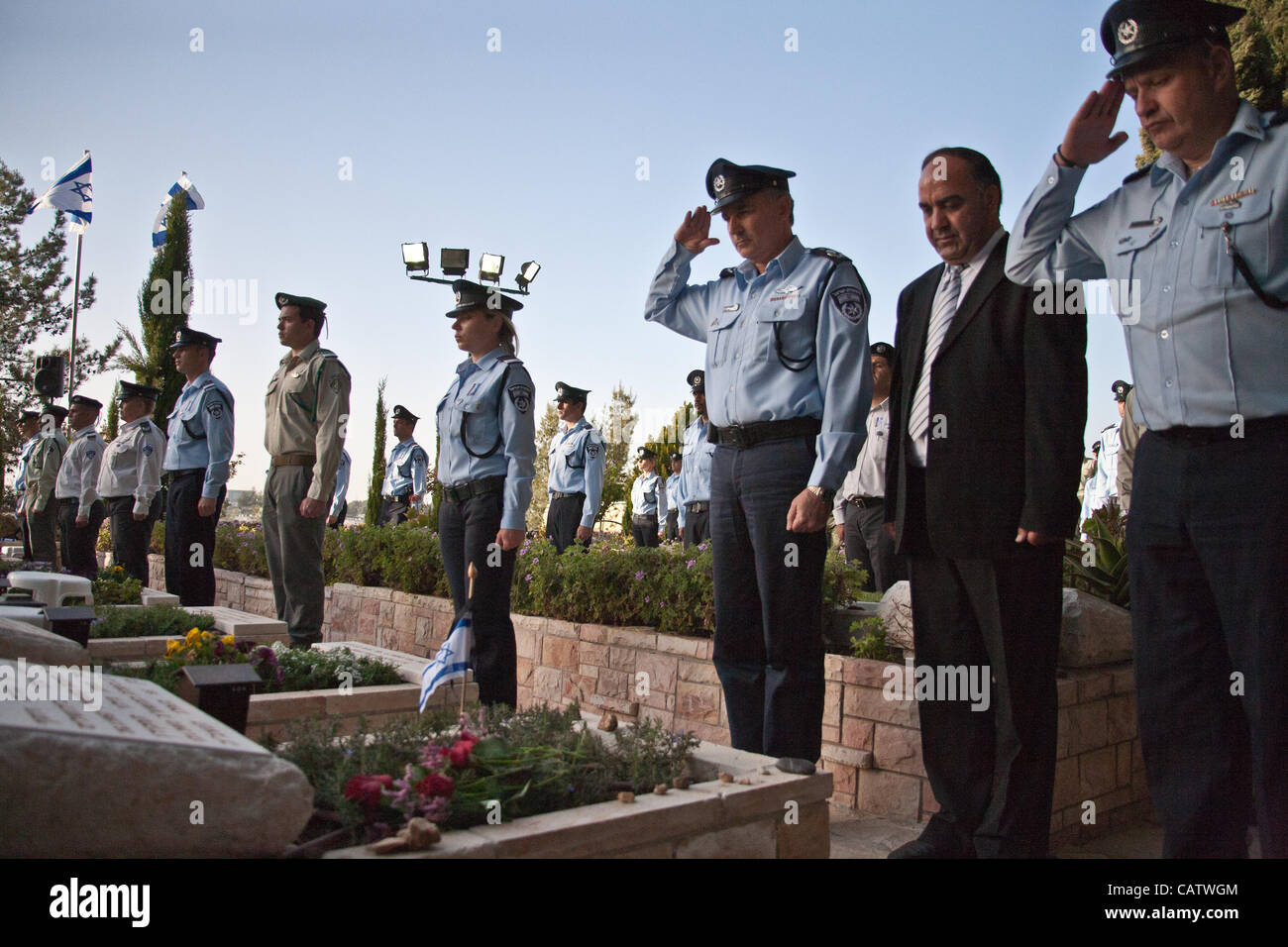 Israel Police Commissioner, Yohanan Danino (3rd from right) salutes ...