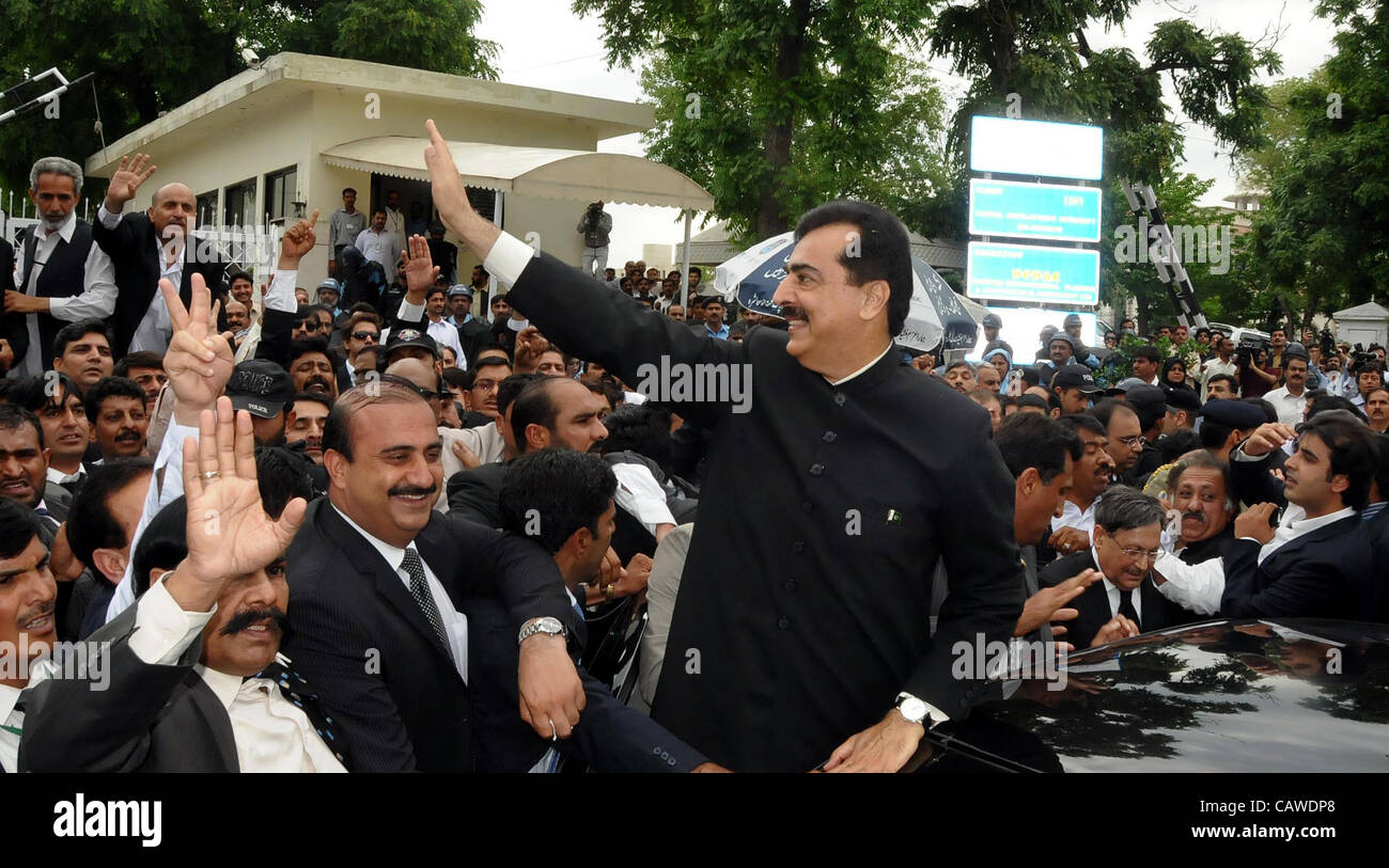 Prime Minister, Syed Yousuf Raza Gilani waves hand to crowd after his ...