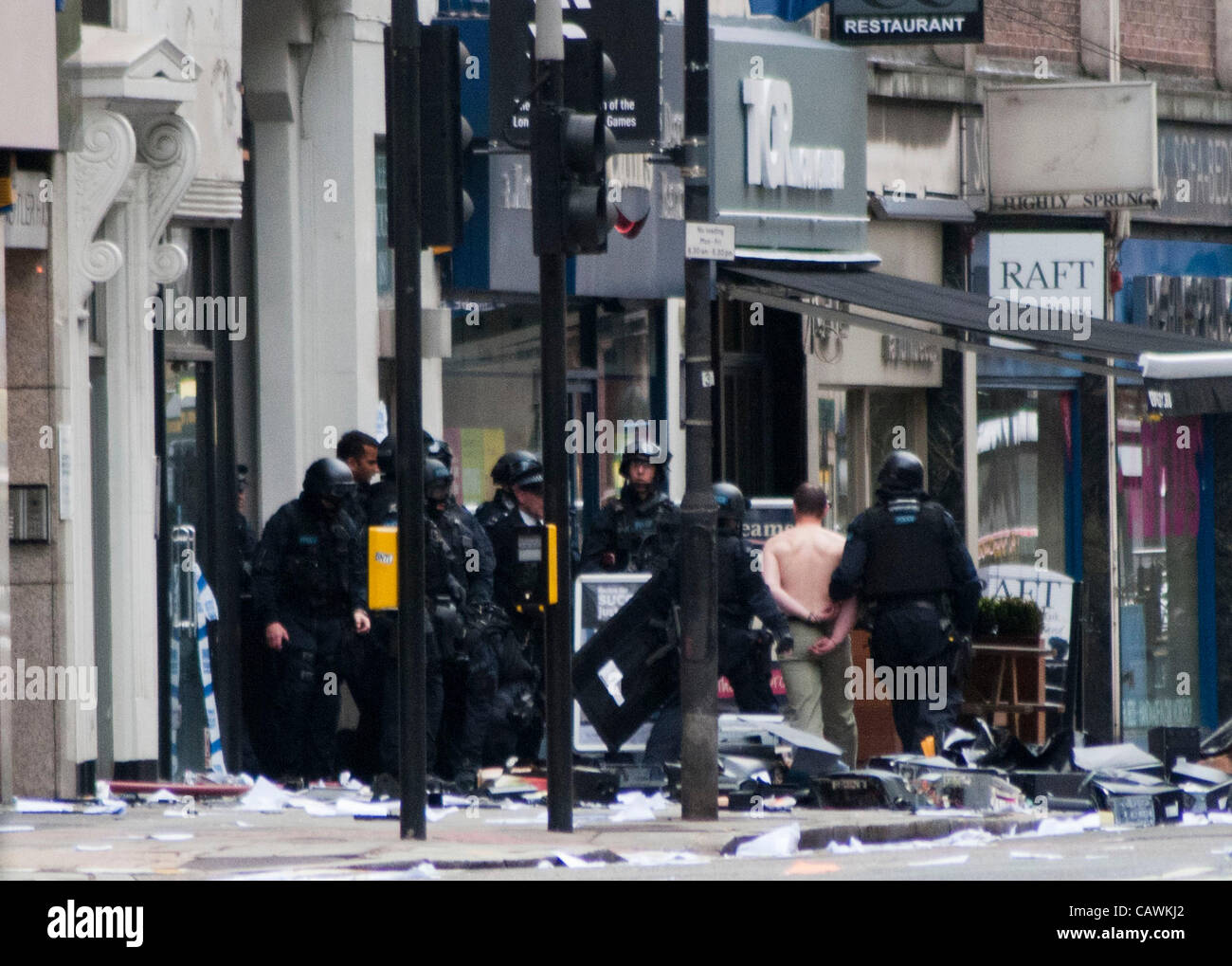 London, UK. 27/04/12. Armed police arrest the suspected hostage taker ...