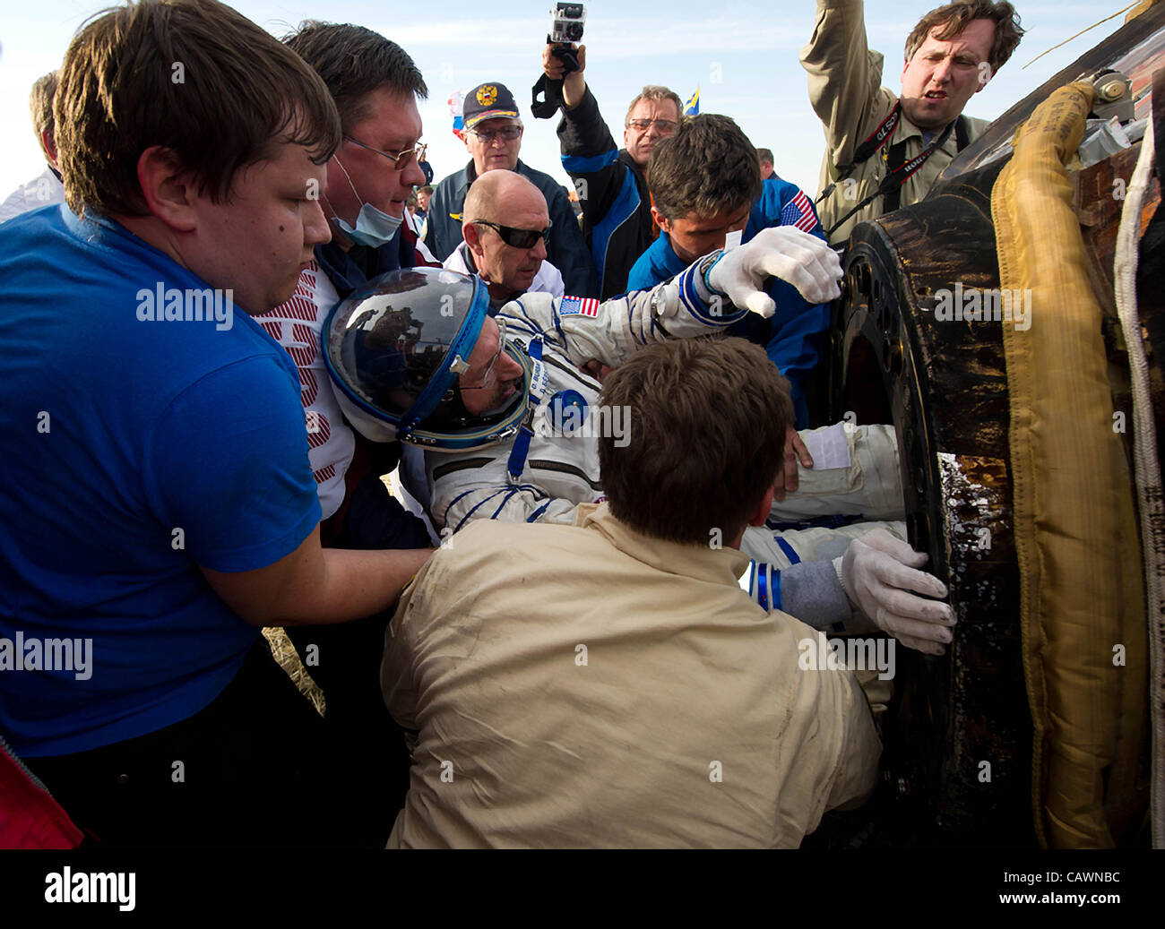 Expedition 30 Commander Dan Burbank is seen as he is extracted from the ...
