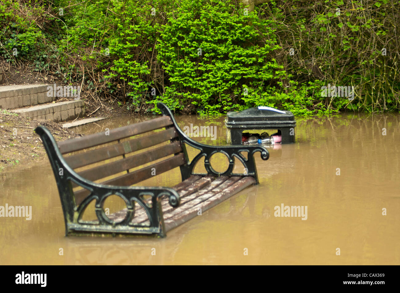 Bench and Bin in rising Flood Water Stock Photo - Alamy