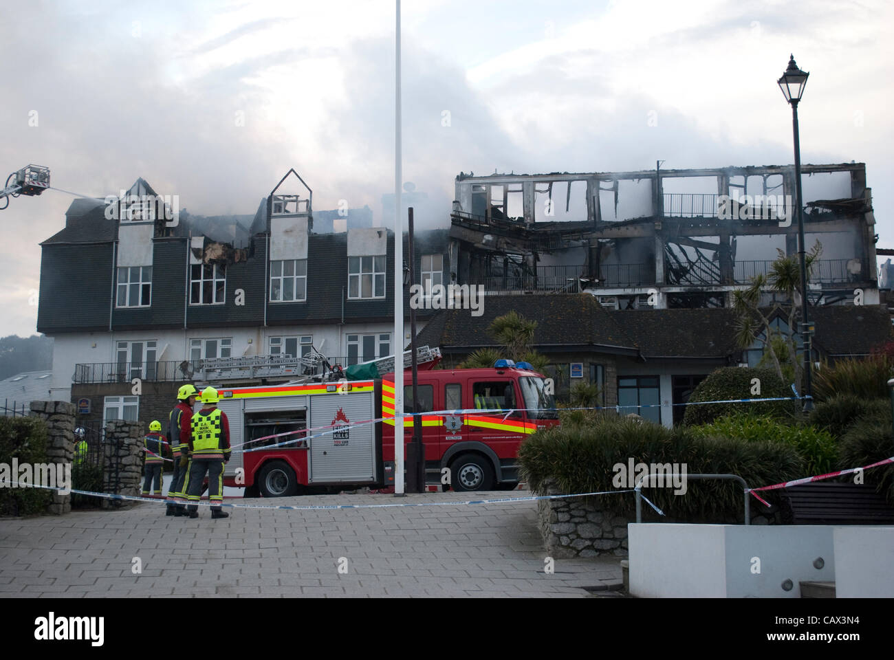 Two fire officers look at Falmouth's Best Western Seafront hotel is ...