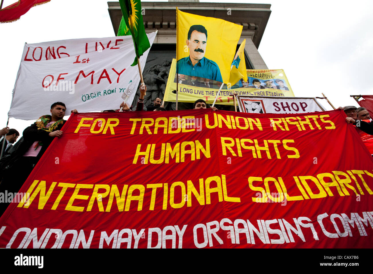 London, United Kingdom, 01/05/2012. Union banners held on the plinth of ...