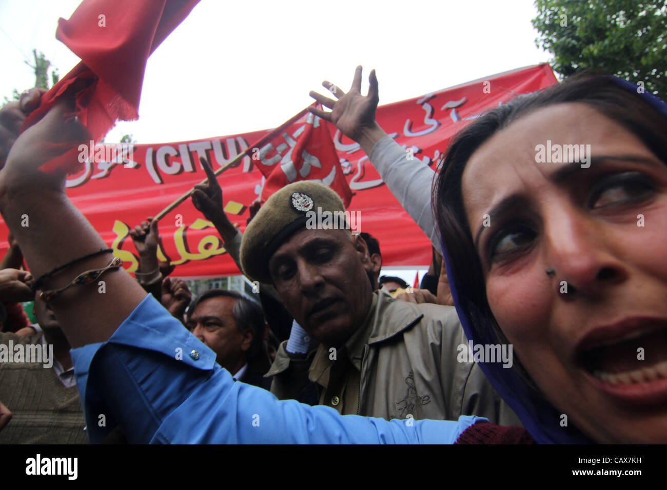 kashmiri muslim Female Trade union worker shout slogans as they march ...