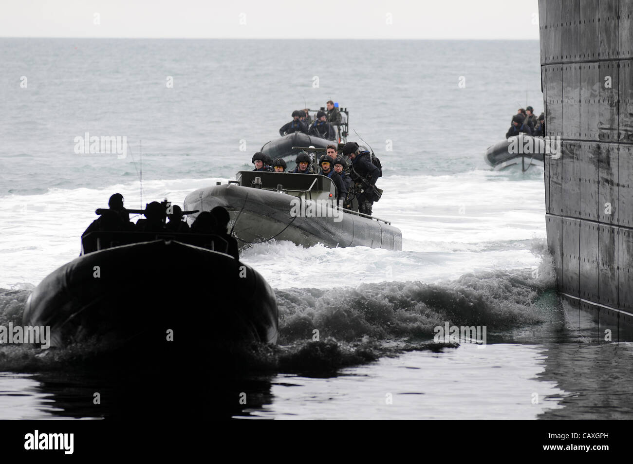 HMS Bulwark, Royal Navy flagship, Britain, UK, ribs carrying troops ...