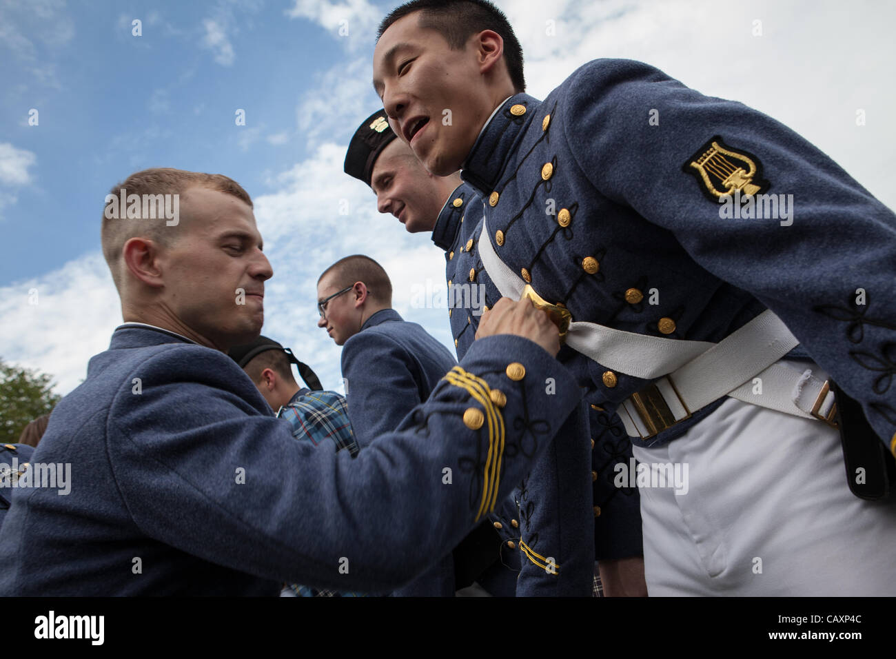Graduating seniors at the Citadel perform the brassing ceremony ...