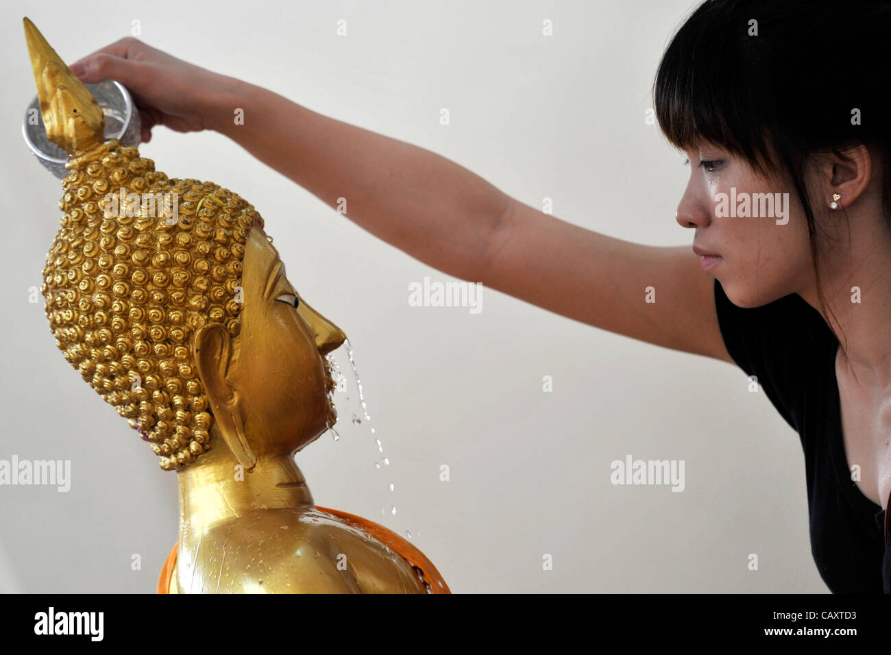 May 5, 2012 - Kuala Lumpur, Malaysia - A Buddhist devotee pours water ...
