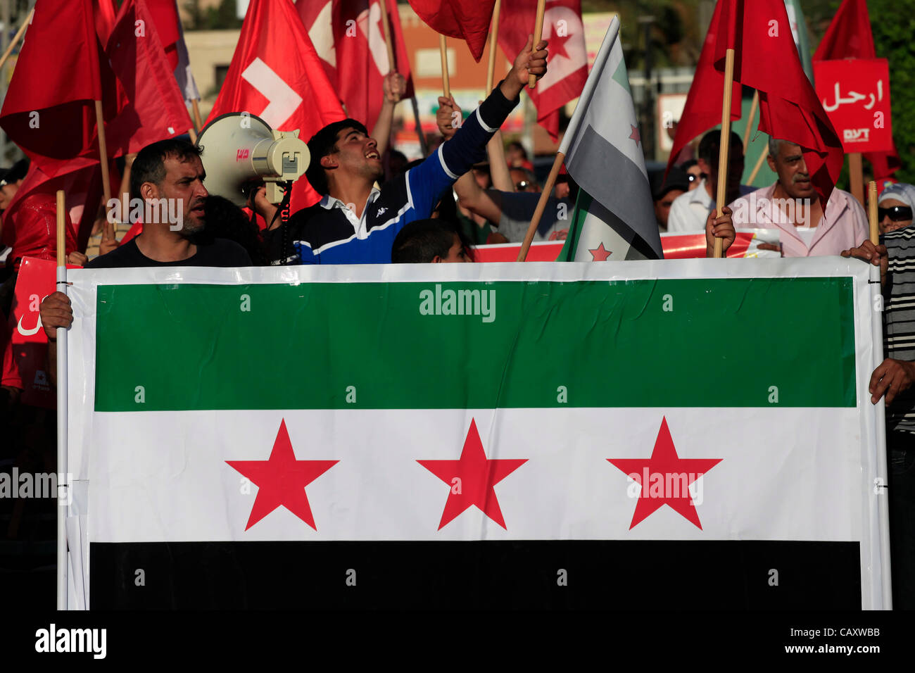 Israeli Arabs taking part in a solidarity rally with the Syrian ...