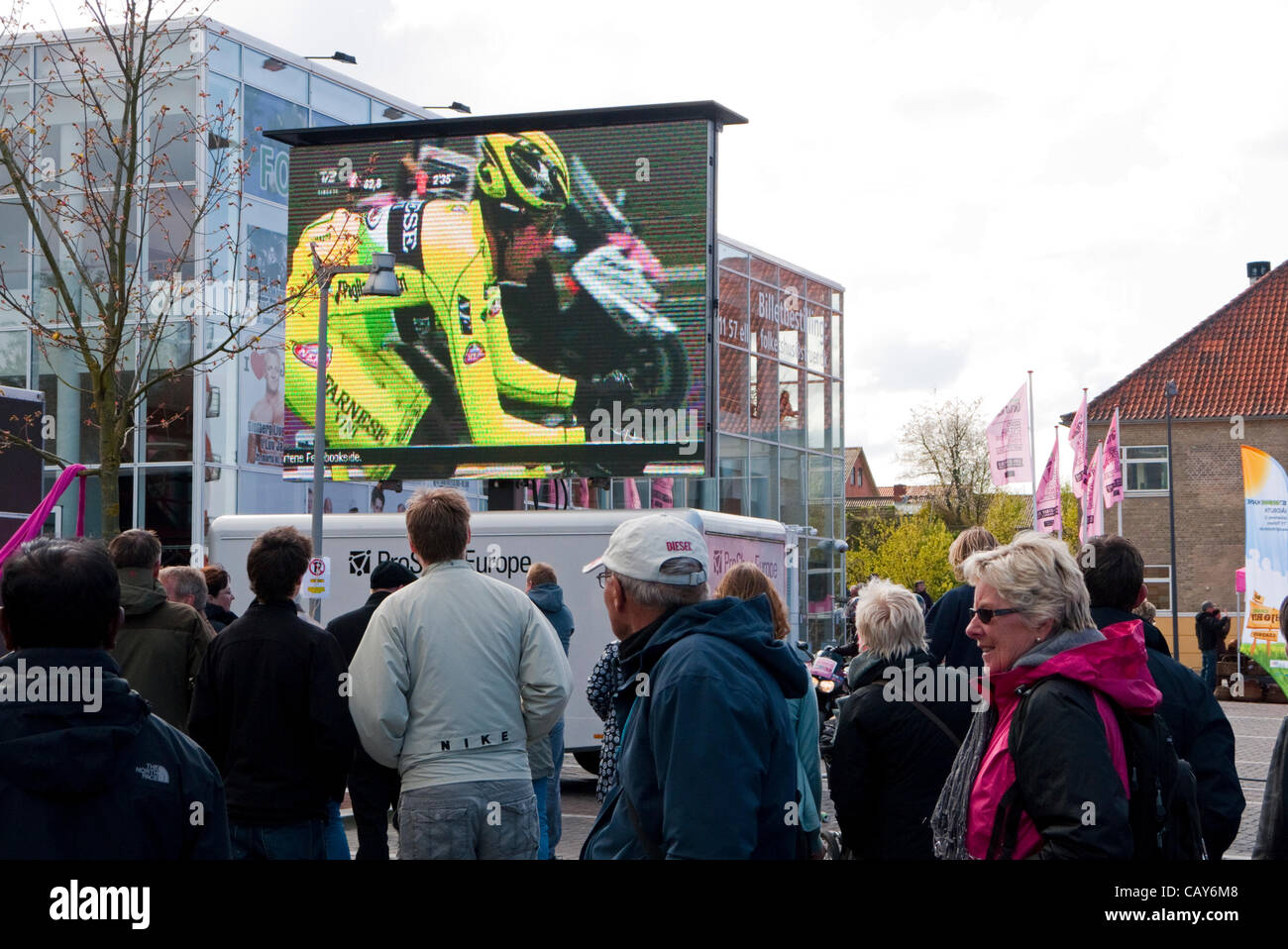 Crowd following the race at big screen Stock Photo - Alamy