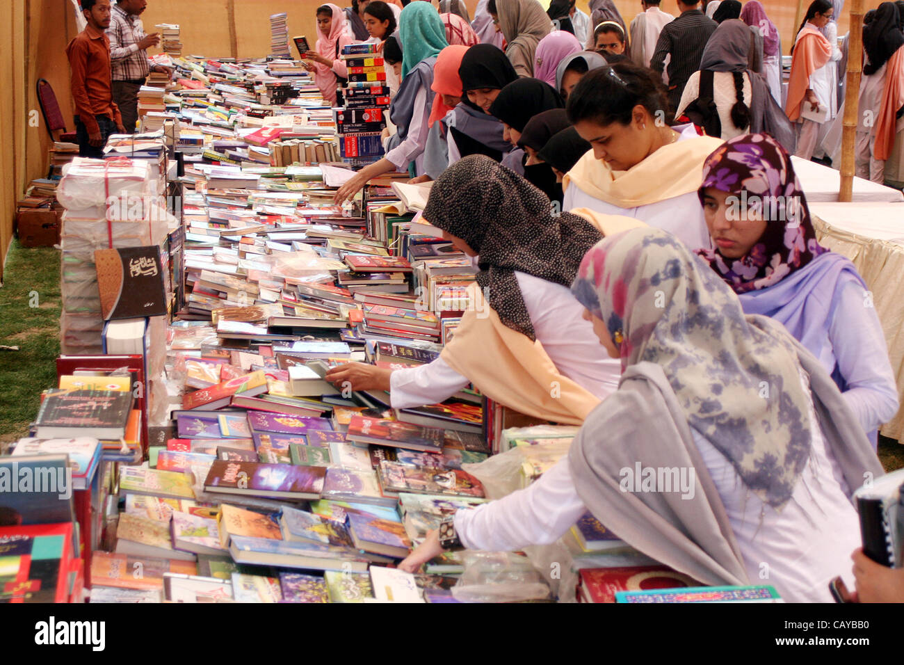 Students look different books on stalls during Book Fair held at Jinnah ...