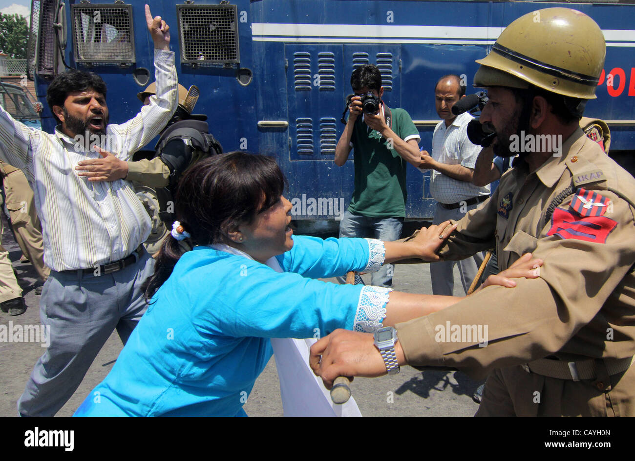 Indian police arrest Kashmiri government employees during a protest in ...