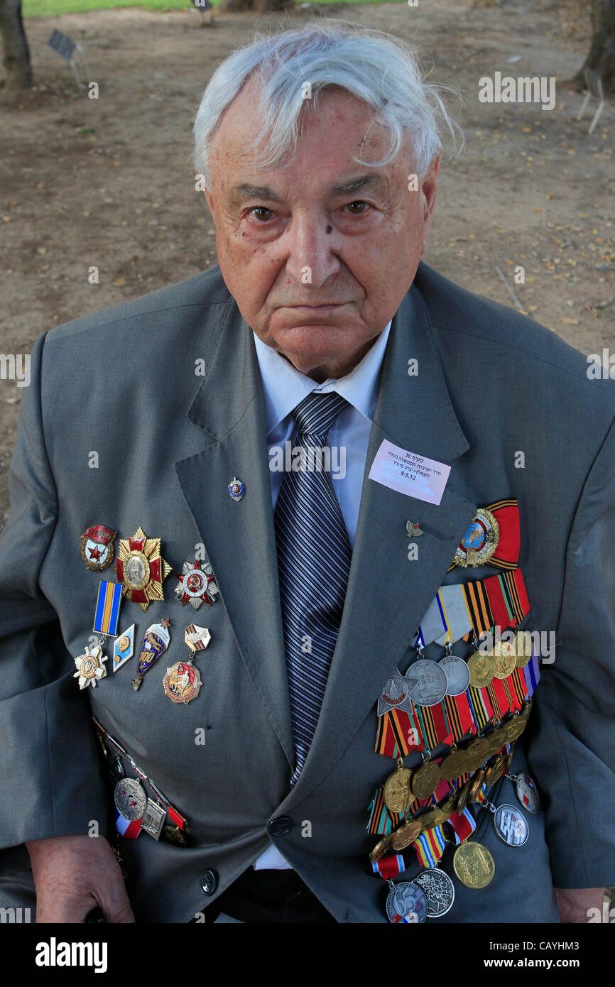 A soviet Jewish World War II veteran with medals pinned in his suit ...