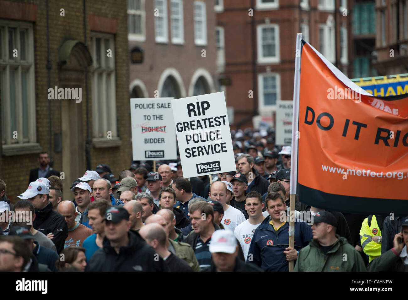 UK police officers and supporters march through central London to ...