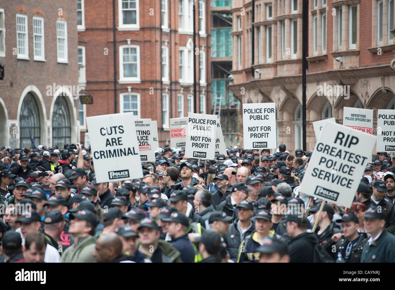 UK police officers and supporters march through central London to ...