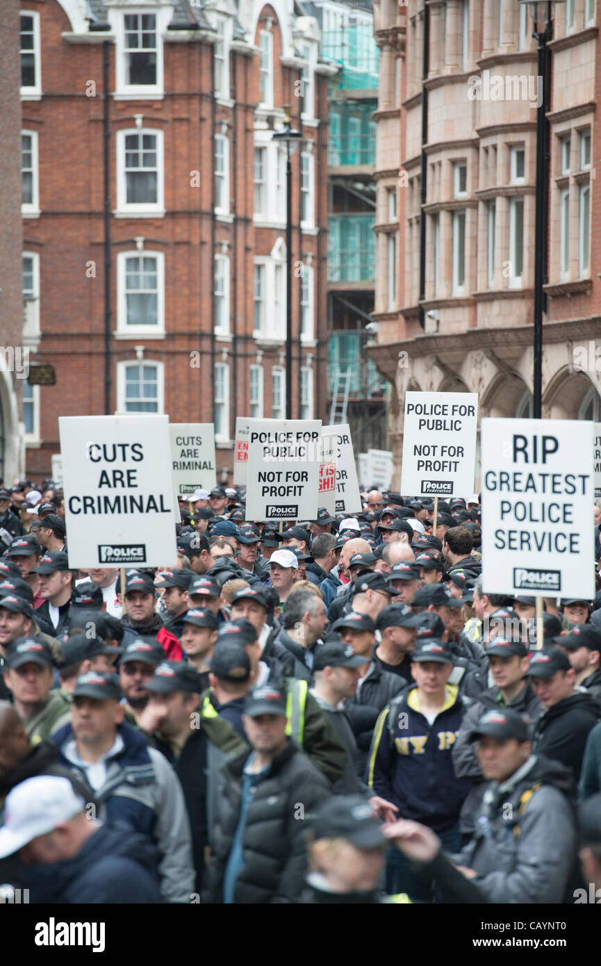 UK police officers and supporters march through central London to ...