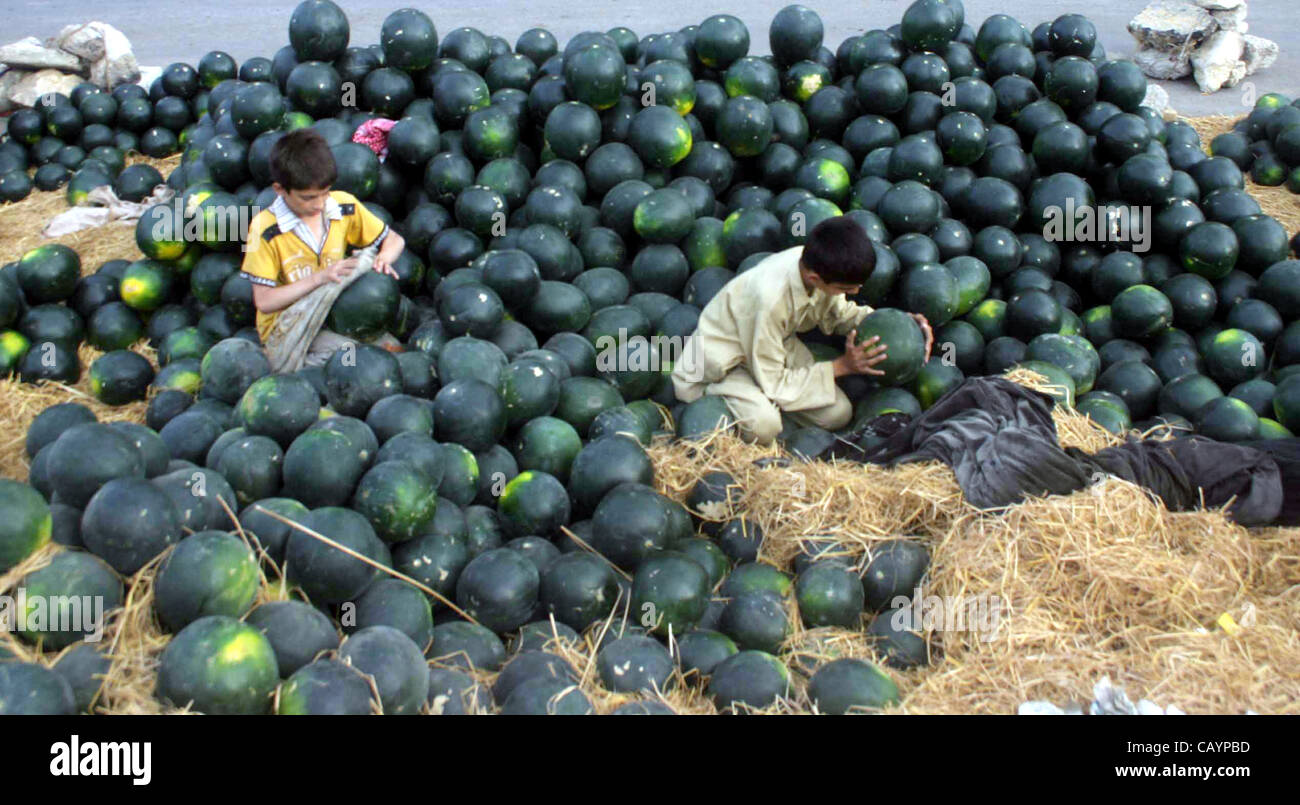 Children arrange watermelons hi-res stock photography and images - Alamy