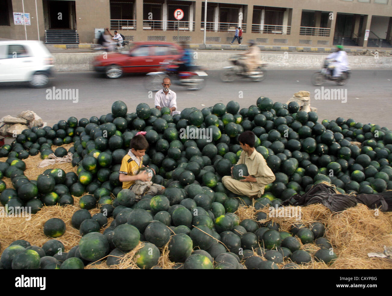 Children arrange watermelons hi-res stock photography and images - Alamy