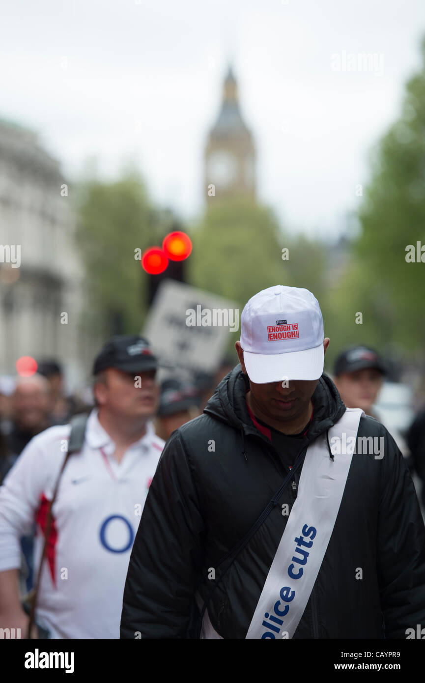 UK police officers marching in central London against the 20% cuts in ...