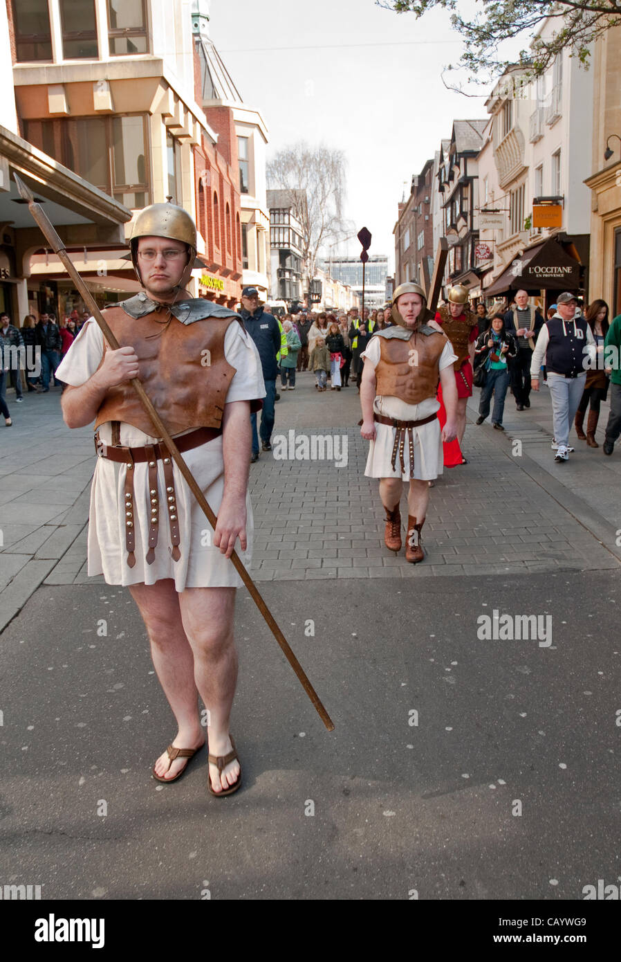 Actors playing Roman soldiers, lead Jesus through the streets of Exeter ...