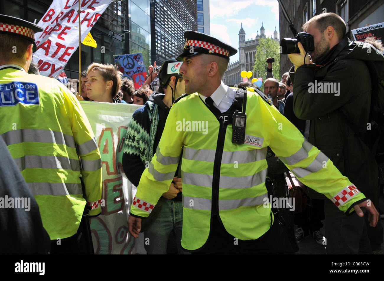 Police officers attempt to hold the line as the Occupy London ...