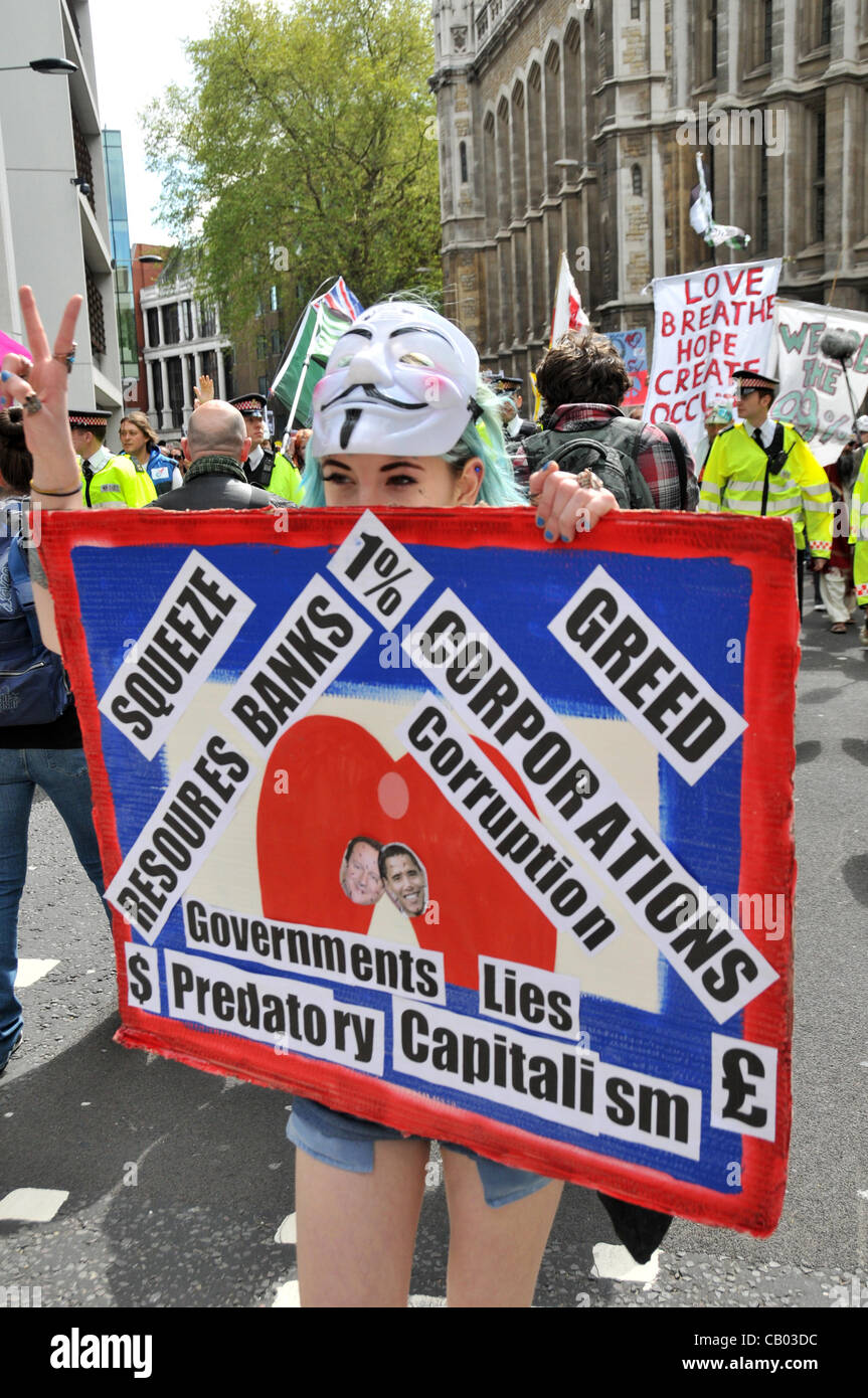 Occupy London demonstrator wearing a banner with anti-capitalist ...