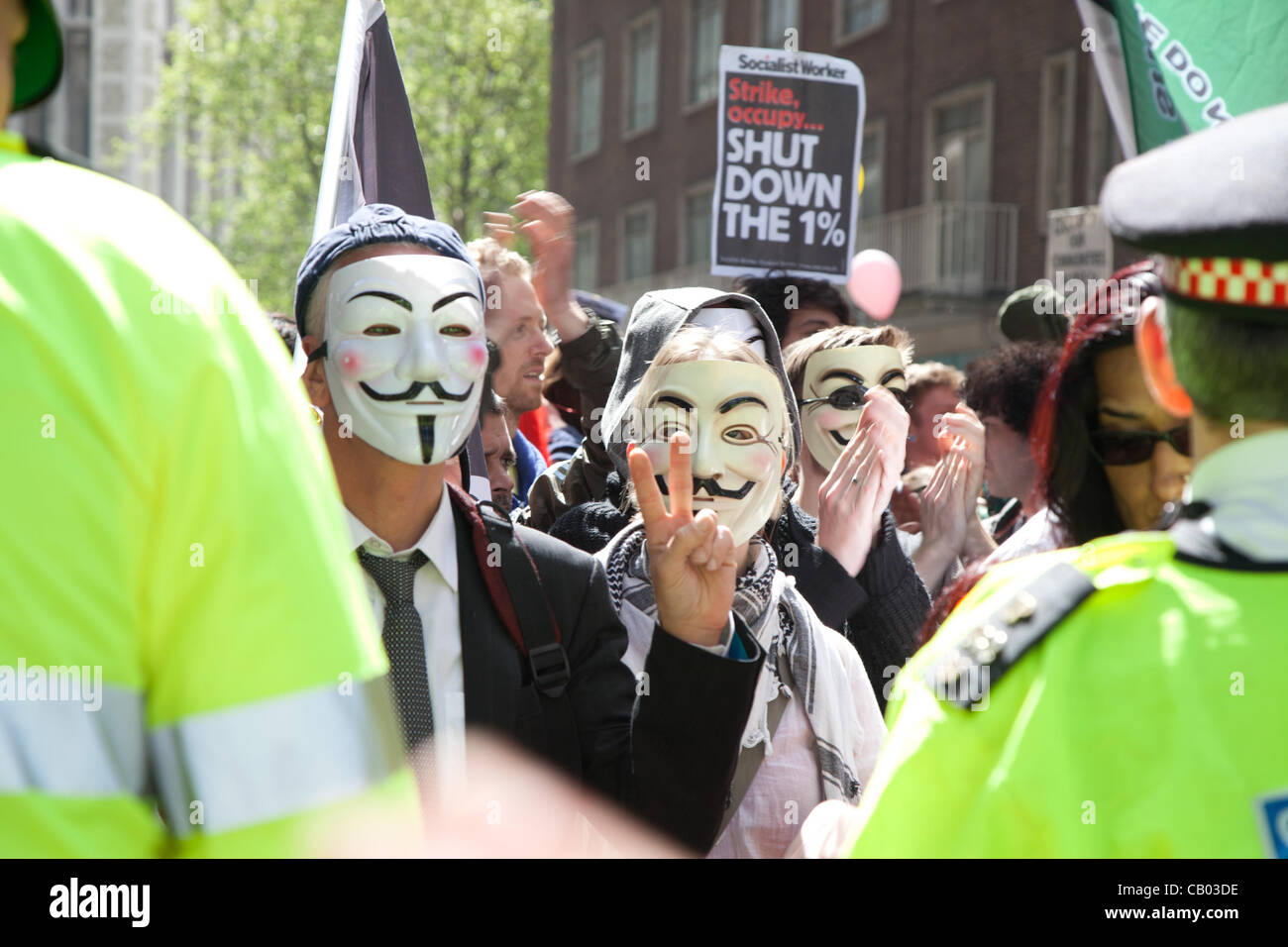 London, UK. 12 May 2012 A protestor wearing the "V Mask" make a peace ...