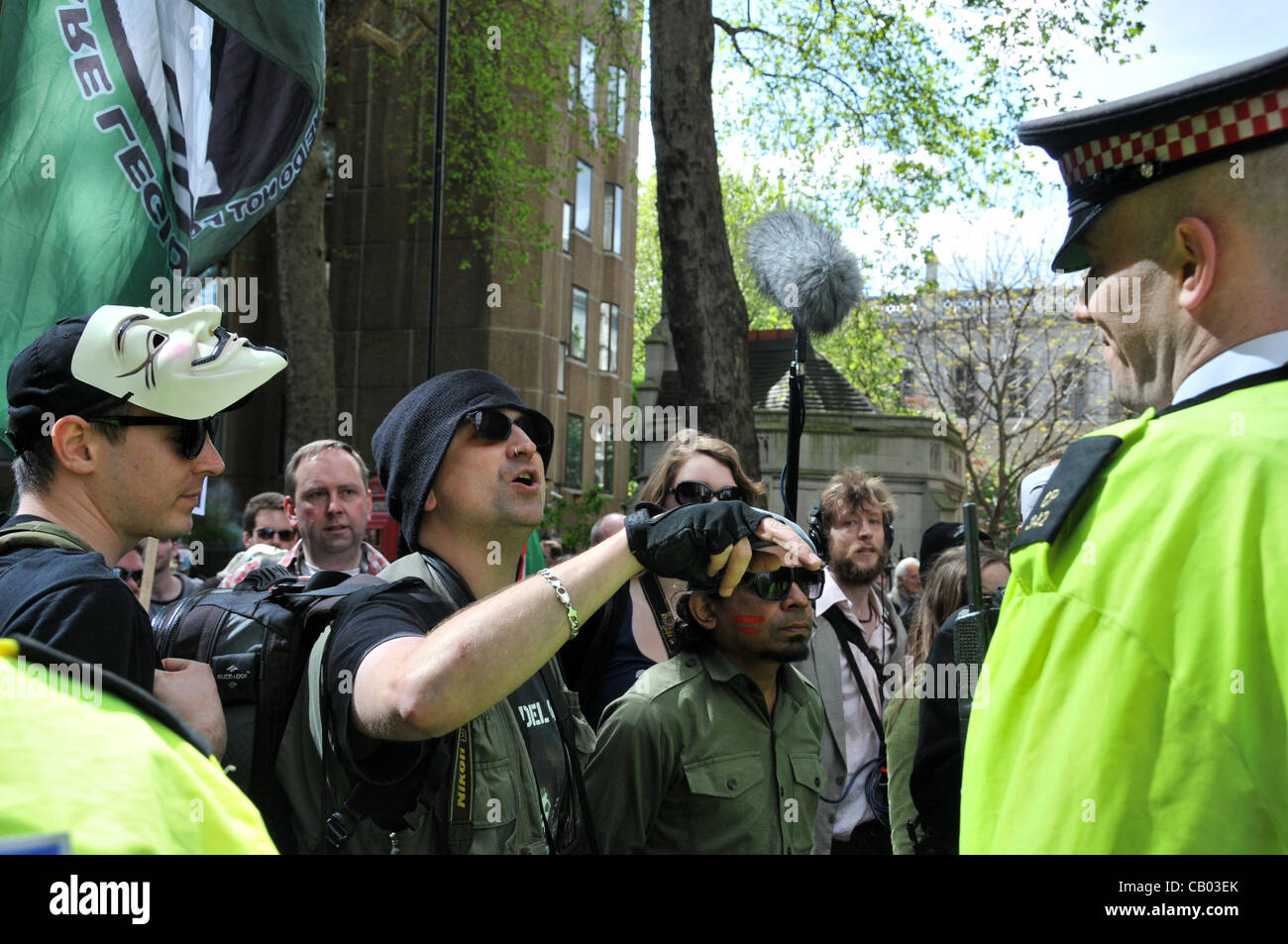 Occupy London demonstrators and police officers confront each other as ...
