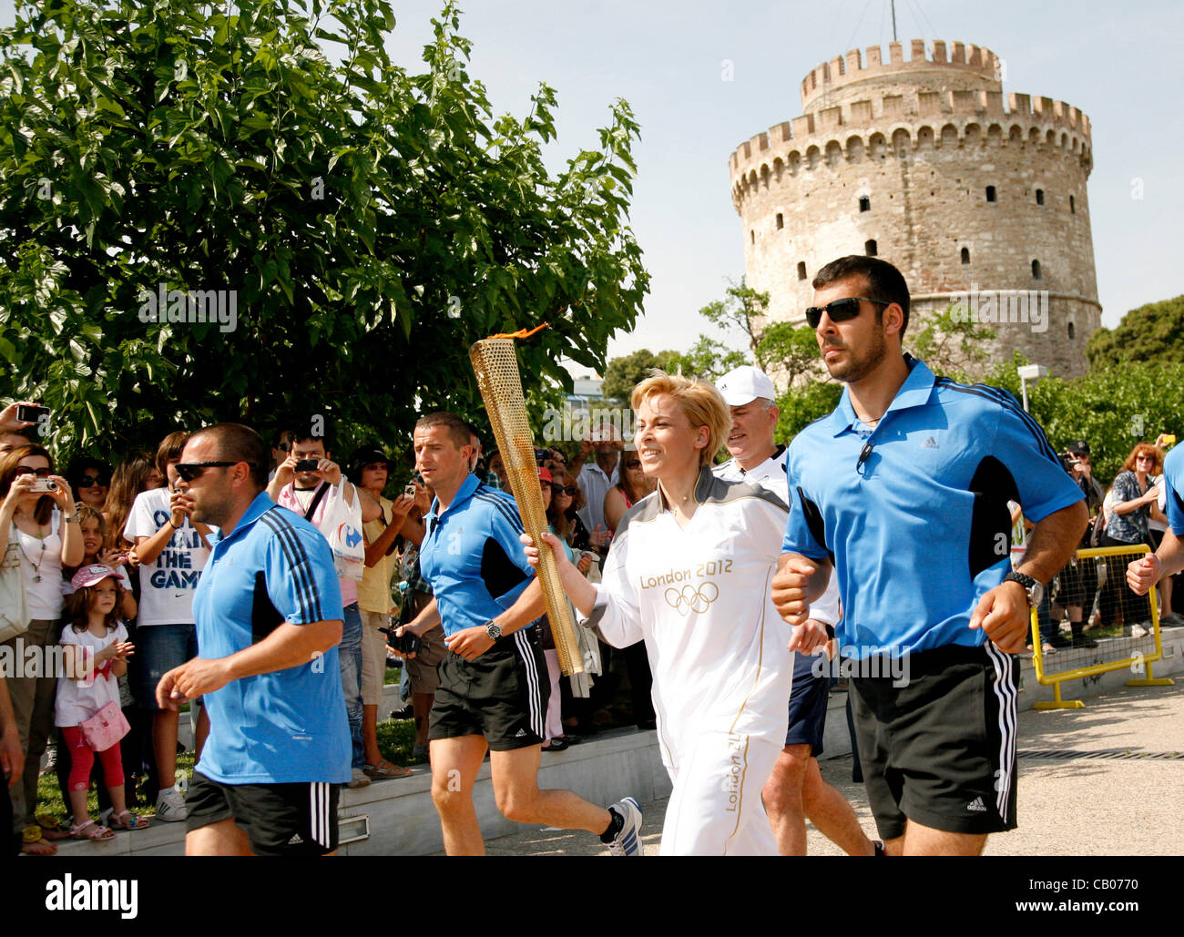 The Olympic flame arrives in Thessaloniki. The torchbearer, Yota ...